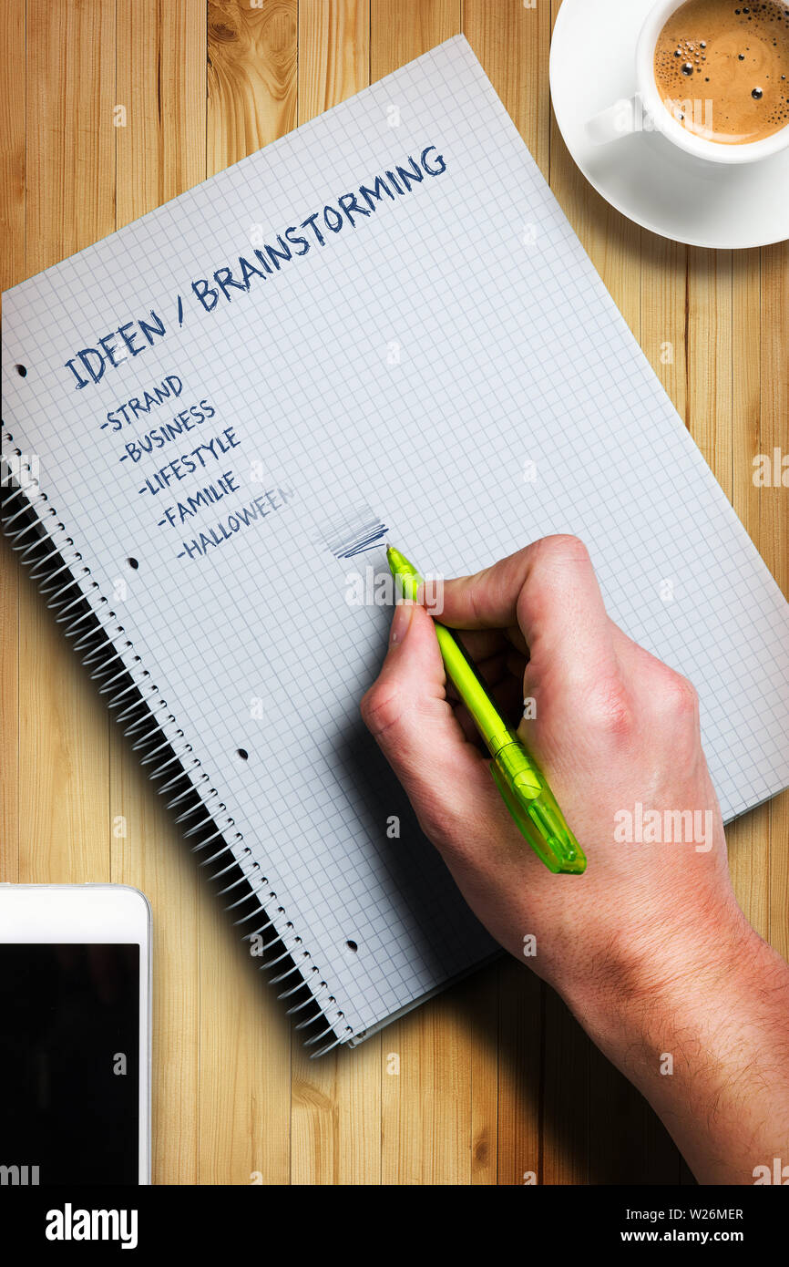 hand writing idea concepts on a college block Stock Photo - Alamy