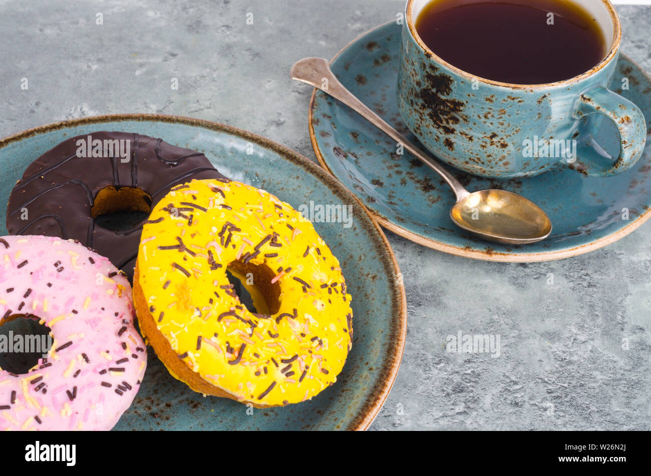 Fresh donuts, hot tea for lunch Stock Photo - Alamy