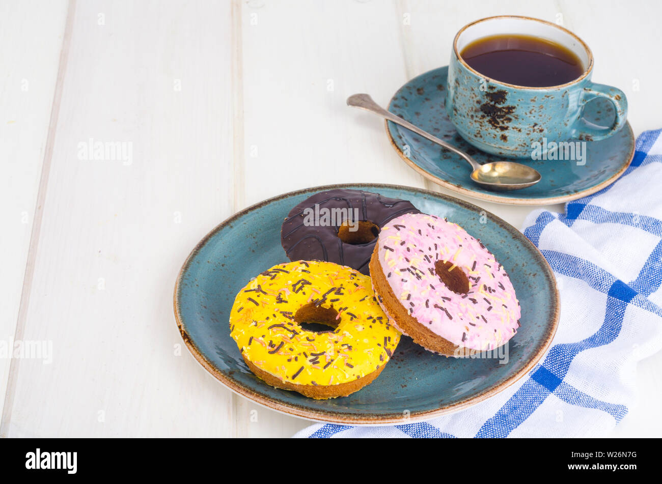 Fresh donuts, hot tea for lunch Stock Photo - Alamy