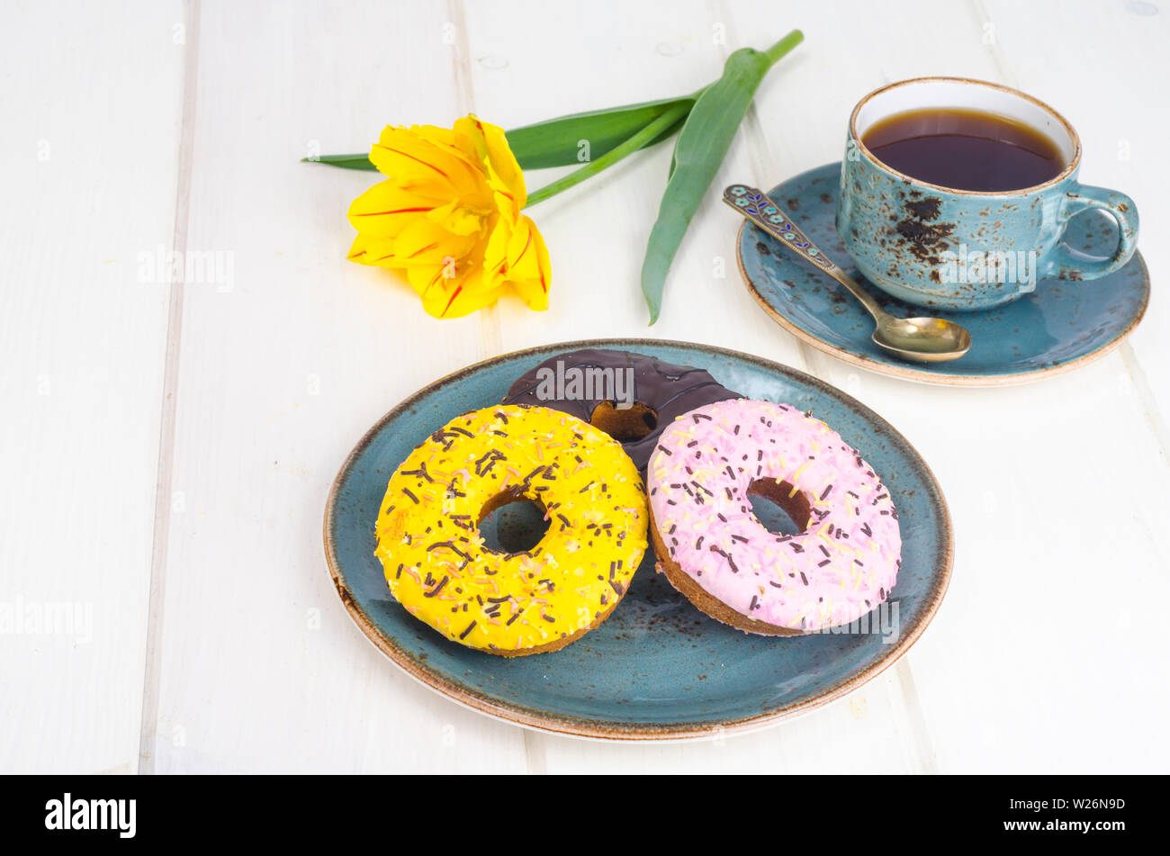 Fresh donuts, hot tea for lunch Stock Photo - Alamy