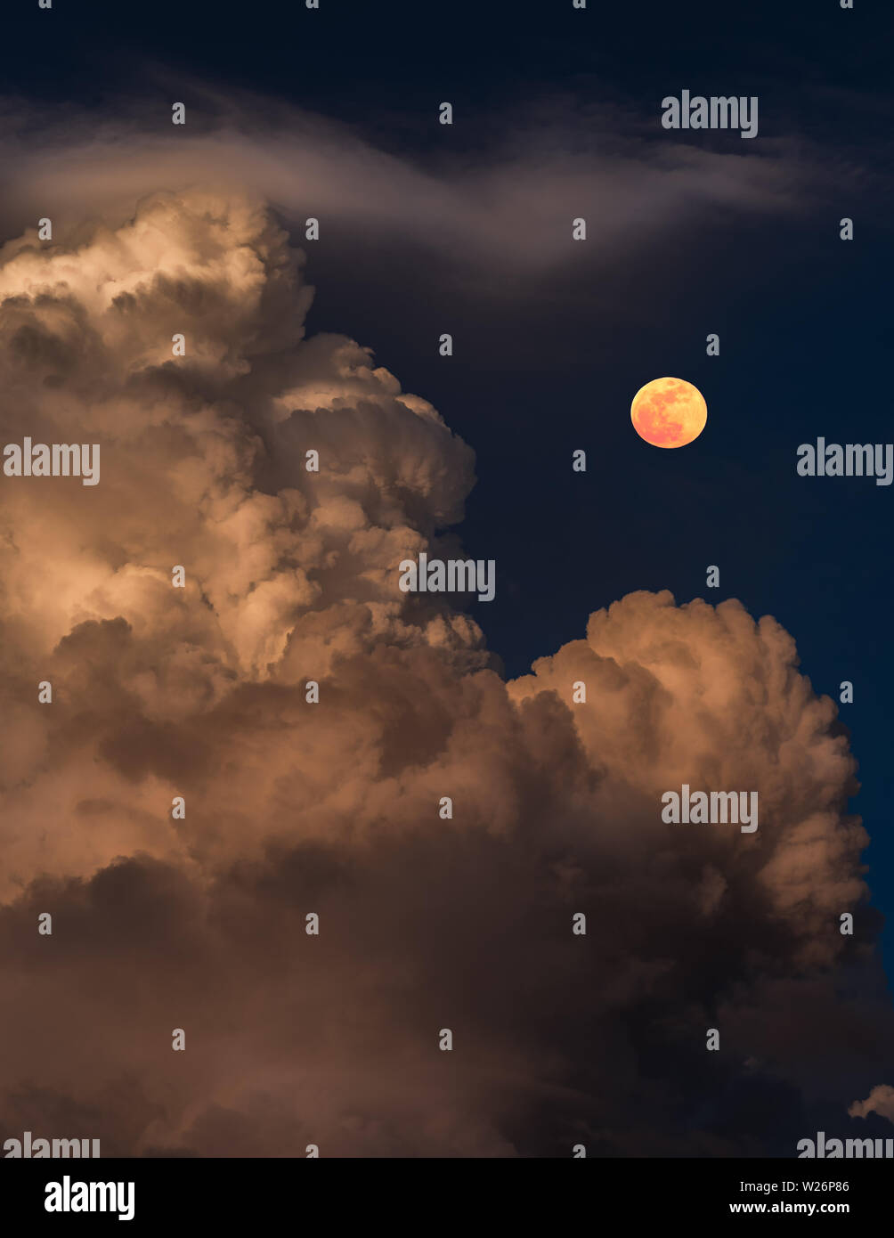 Background of storm clouds with full moon Stock Photo - Alamy