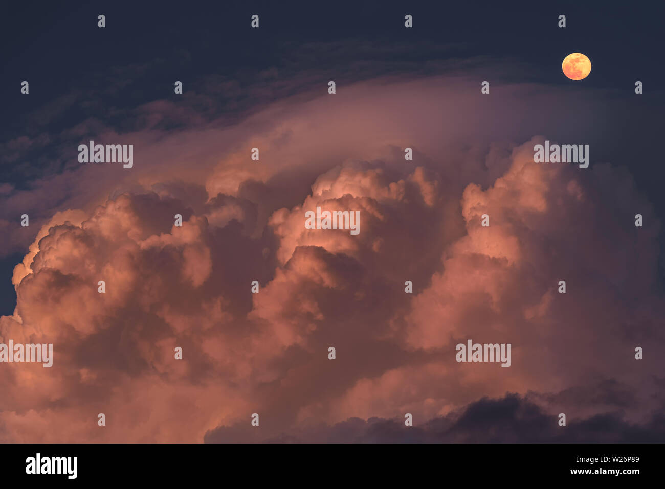 Background of storm clouds with full moon Stock Photo - Alamy