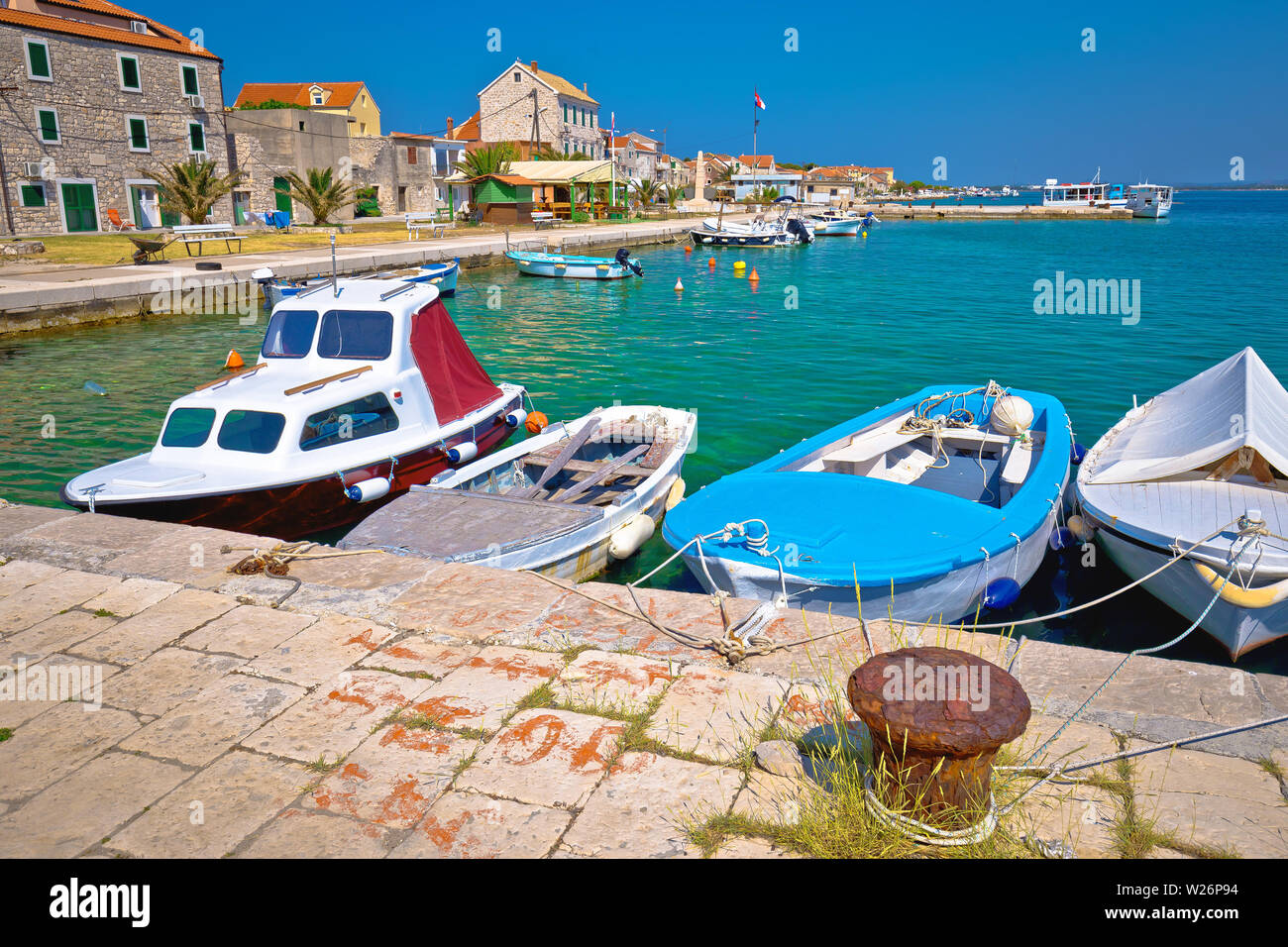 Colorful harbor and waterfront of Krapanj island, sea sponge harvesting ...