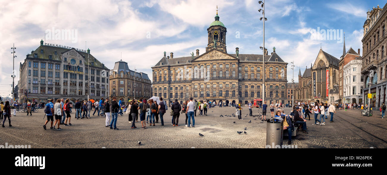 Panoramic view of the Dam Square full of tourists in Amsterdam, Holland ...