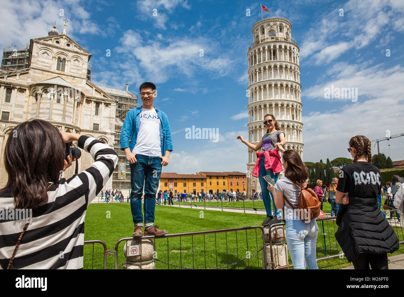 PISA, ITALY - APRIL, 2018: Tourists posing and taking pictures in front ...