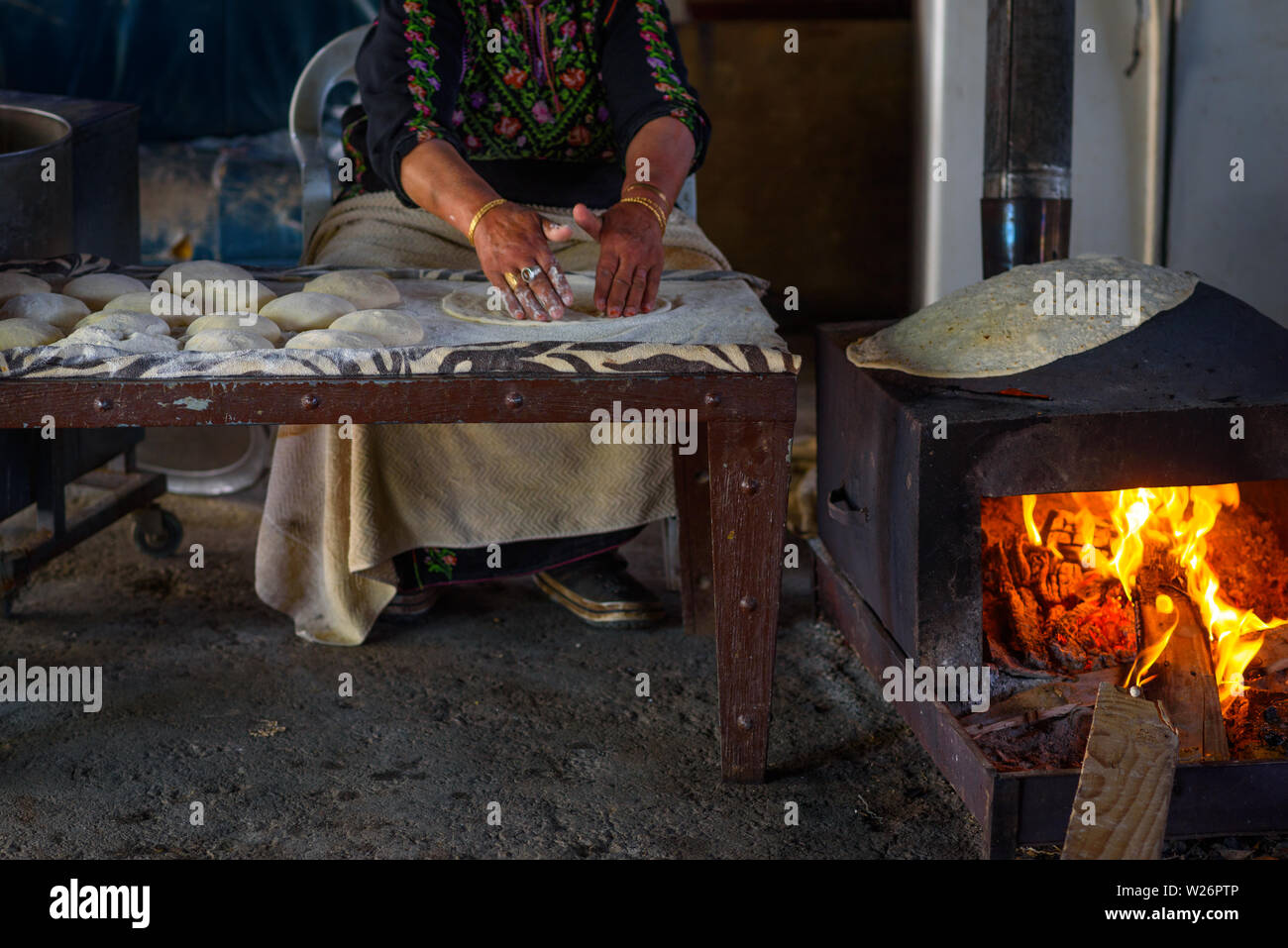 Bedouin baking bread hi-res stock photography and images - Alamy