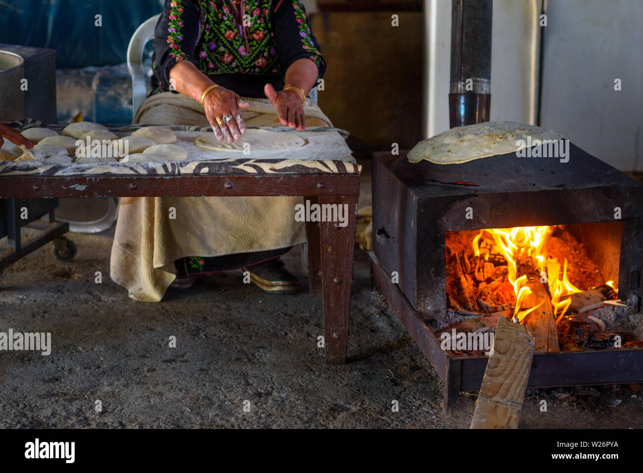 Bedouin baking bread hi-res stock photography and images - Alamy