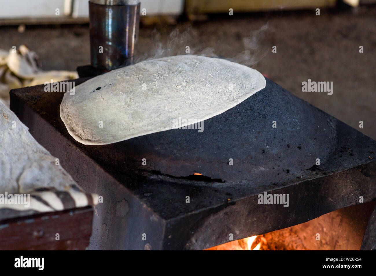 Close up of old Arab woman hands kneading fresh dough for Taboon bread ...