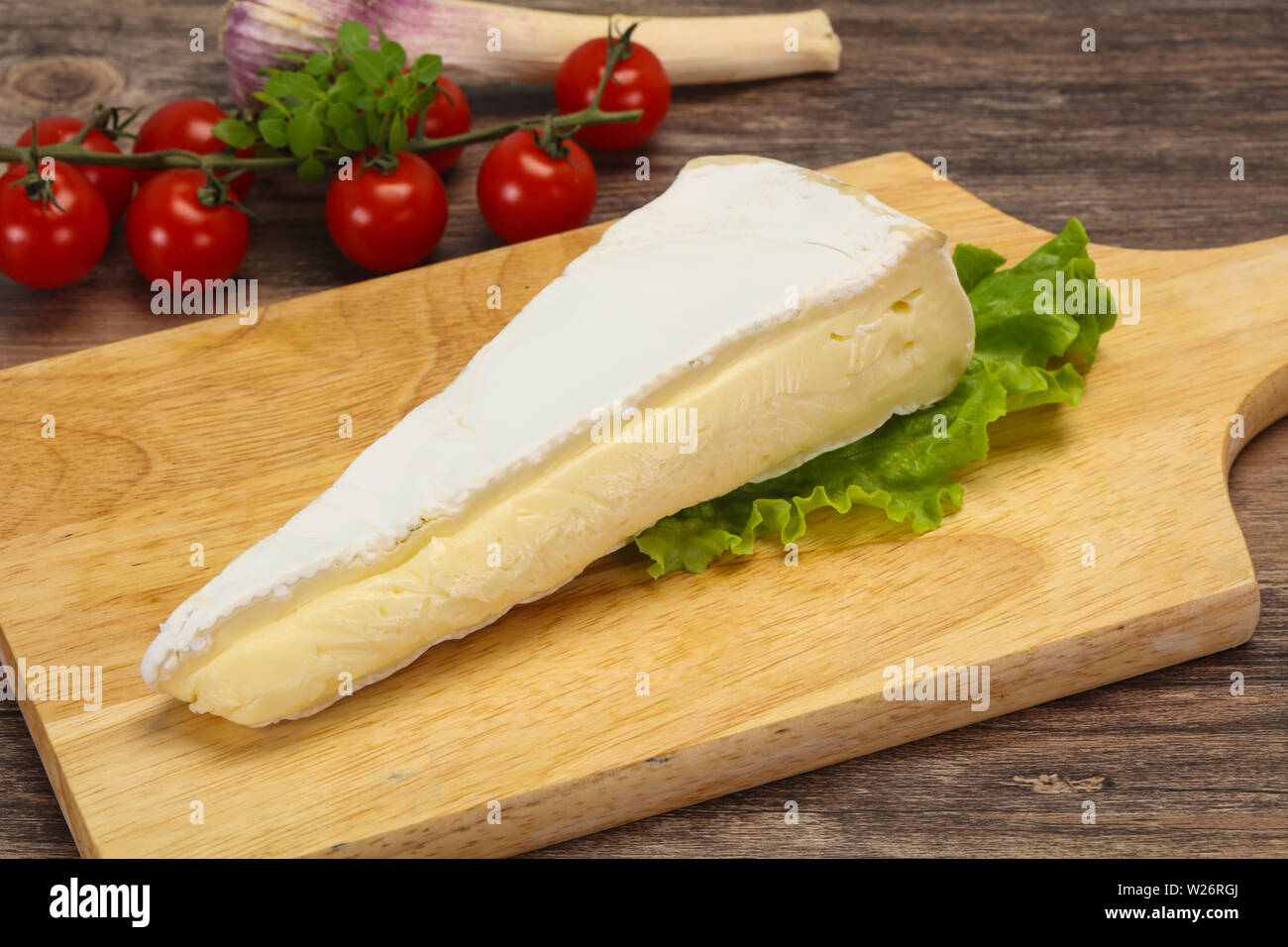 Brie cheese triangle served salad leaves Stock Photo - Alamy