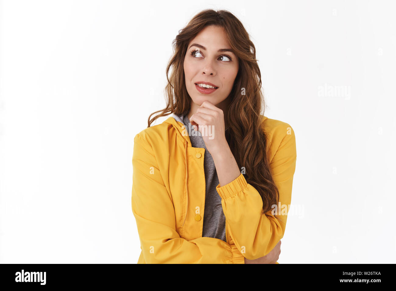 Curious young creative pretty businesswoman pondering plan eyes up ...