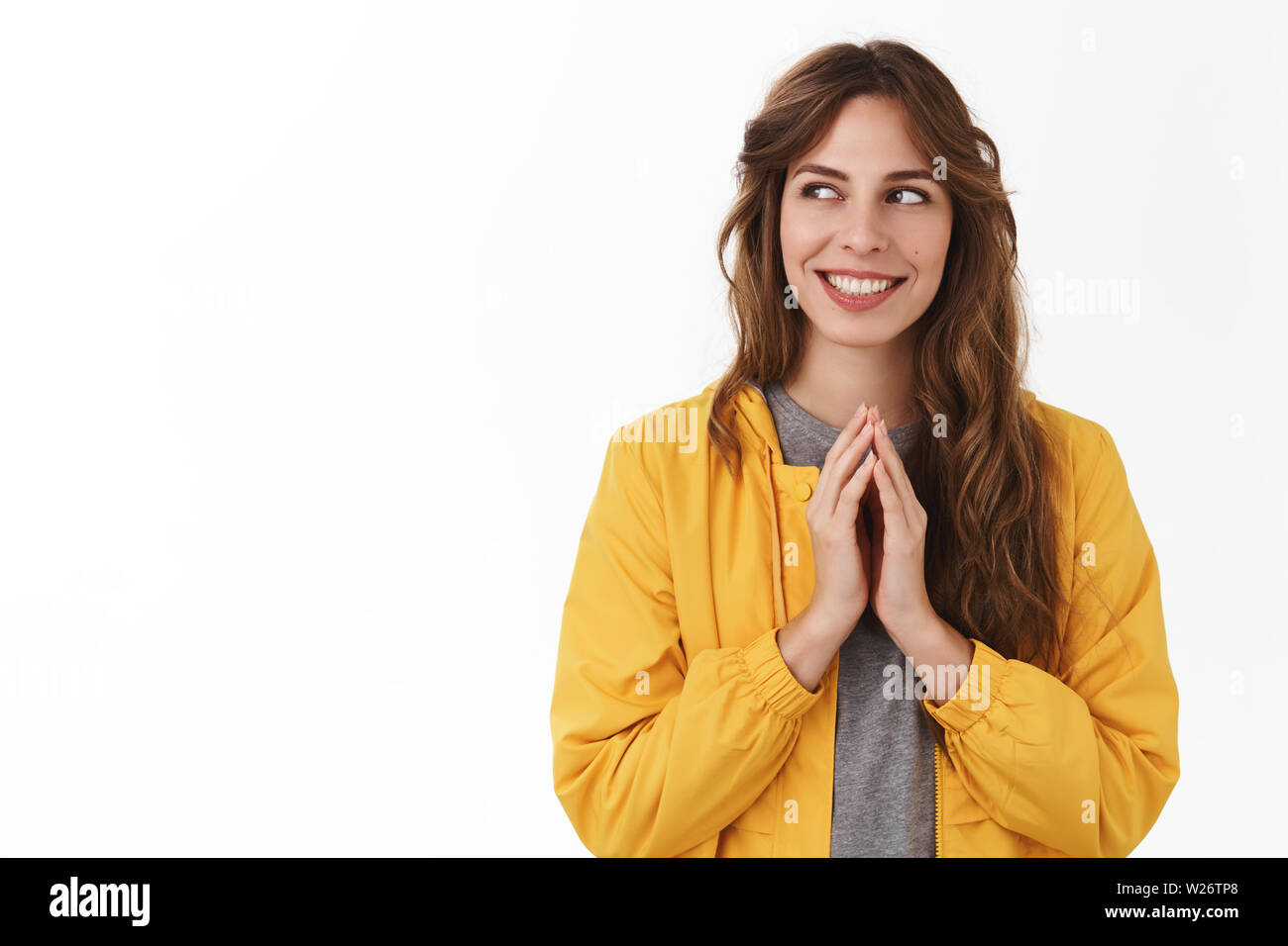 Scheming evil plan. Smart creative young mysterious girl twiddles ...