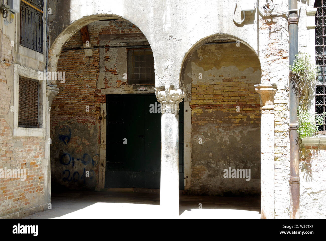 Two strange arches, of different sizes and shapes, one stilted, as if ...