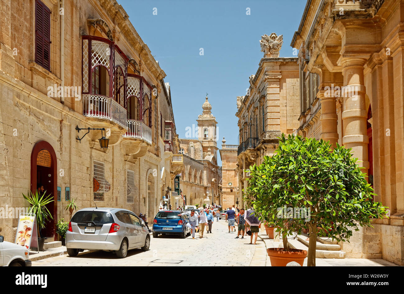 Trg Villegaignon, street scene, old buildings, golden color, people ...