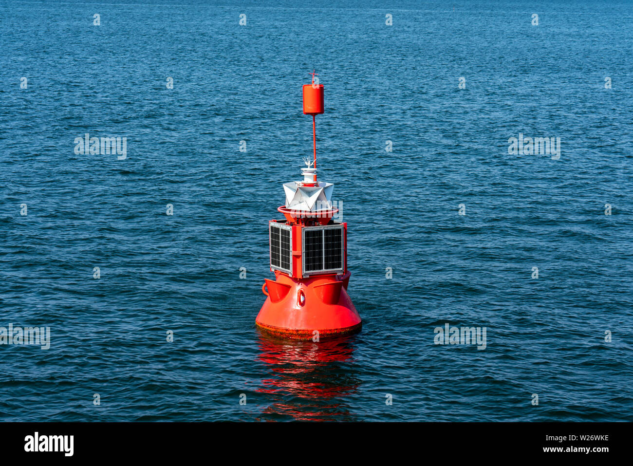 electric red buoy with solar panel anchored in the baltic sea Stock ...