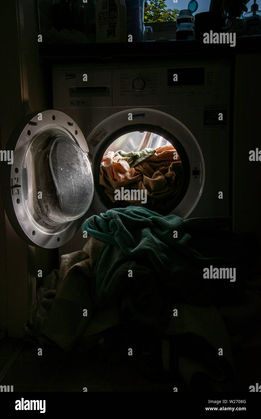 Washing machine with clothes hi-res stock photography and images - Alamy