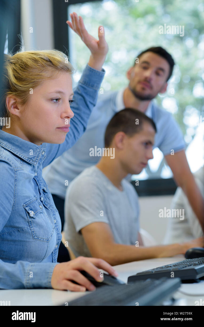 female it student raising her hand Stock Photo - Alamy