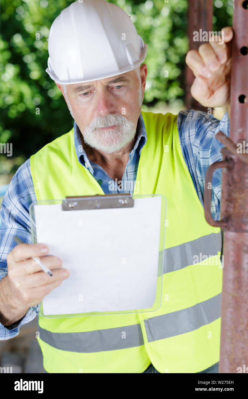 building inspector checking the object Stock Photo - Alamy