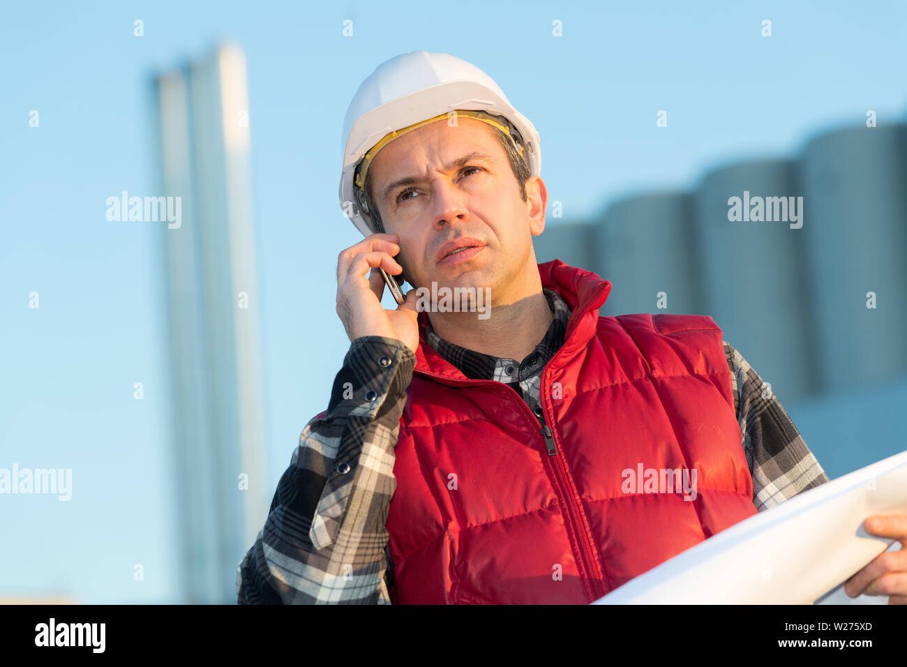 engineer looking into the factory from the outside Stock Photo - Alamy