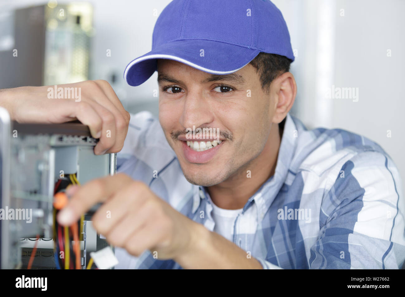 professional man repairing and assembling a computer Stock Photo - Alamy