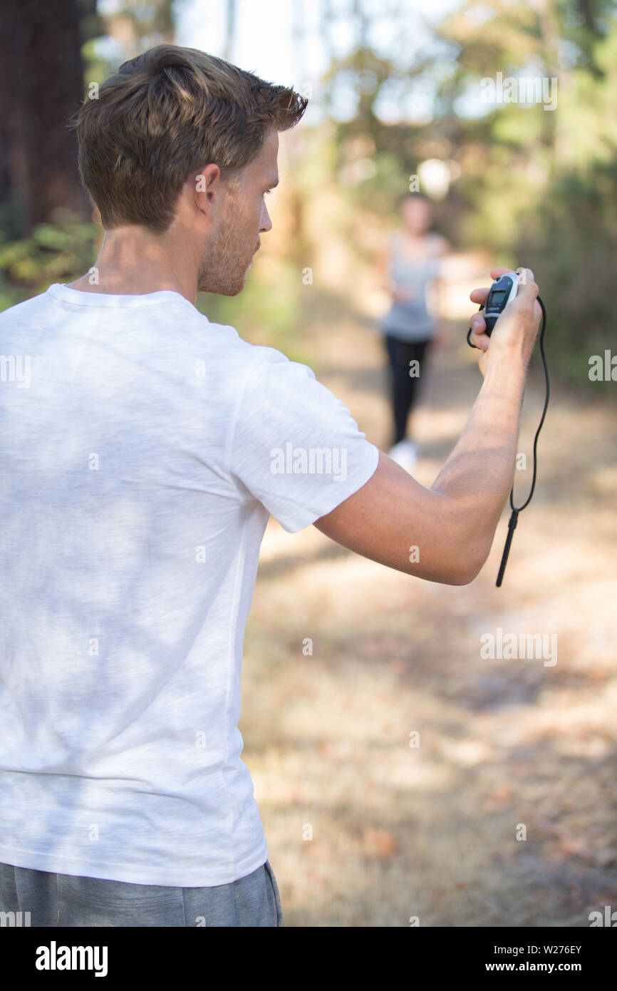 Laughing female runner holding hi-res stock photography and images - Alamy