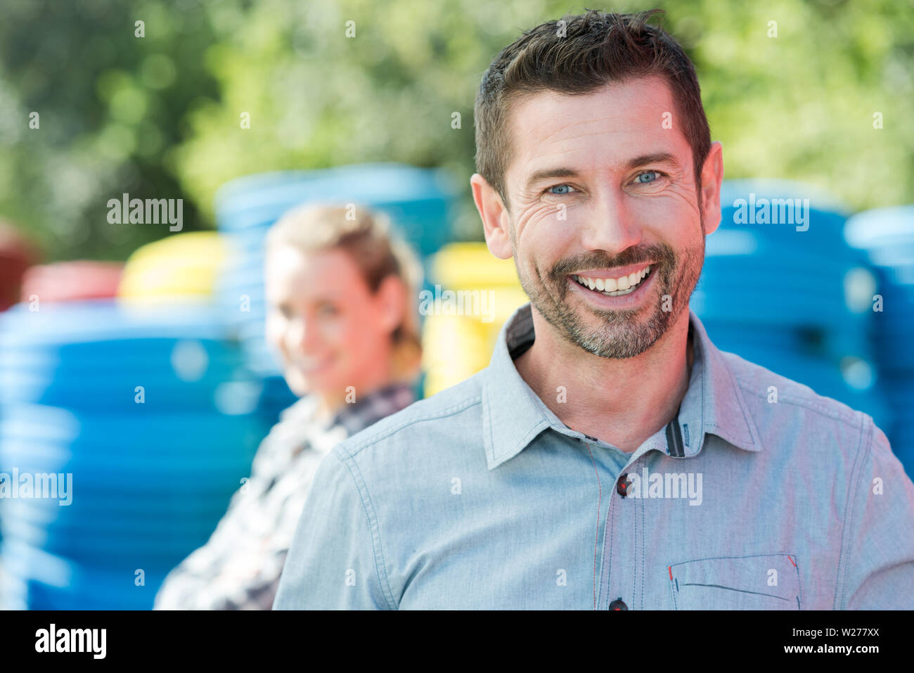 portrait of a happy worker outside the factory Stock Photo - Alamy