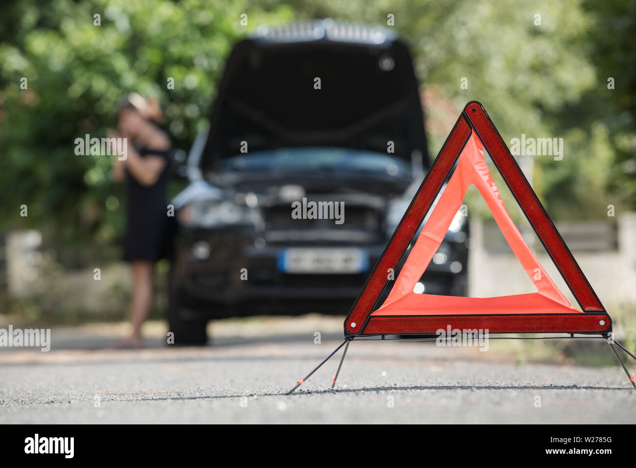 red triangle of a car on the road Stock Photo - Alamy