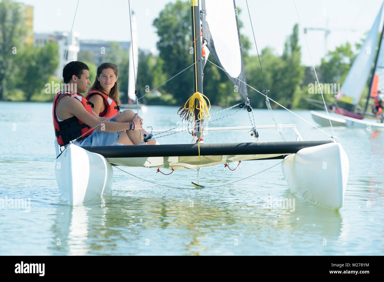 couple sailing in a lake Stock Photo - Alamy