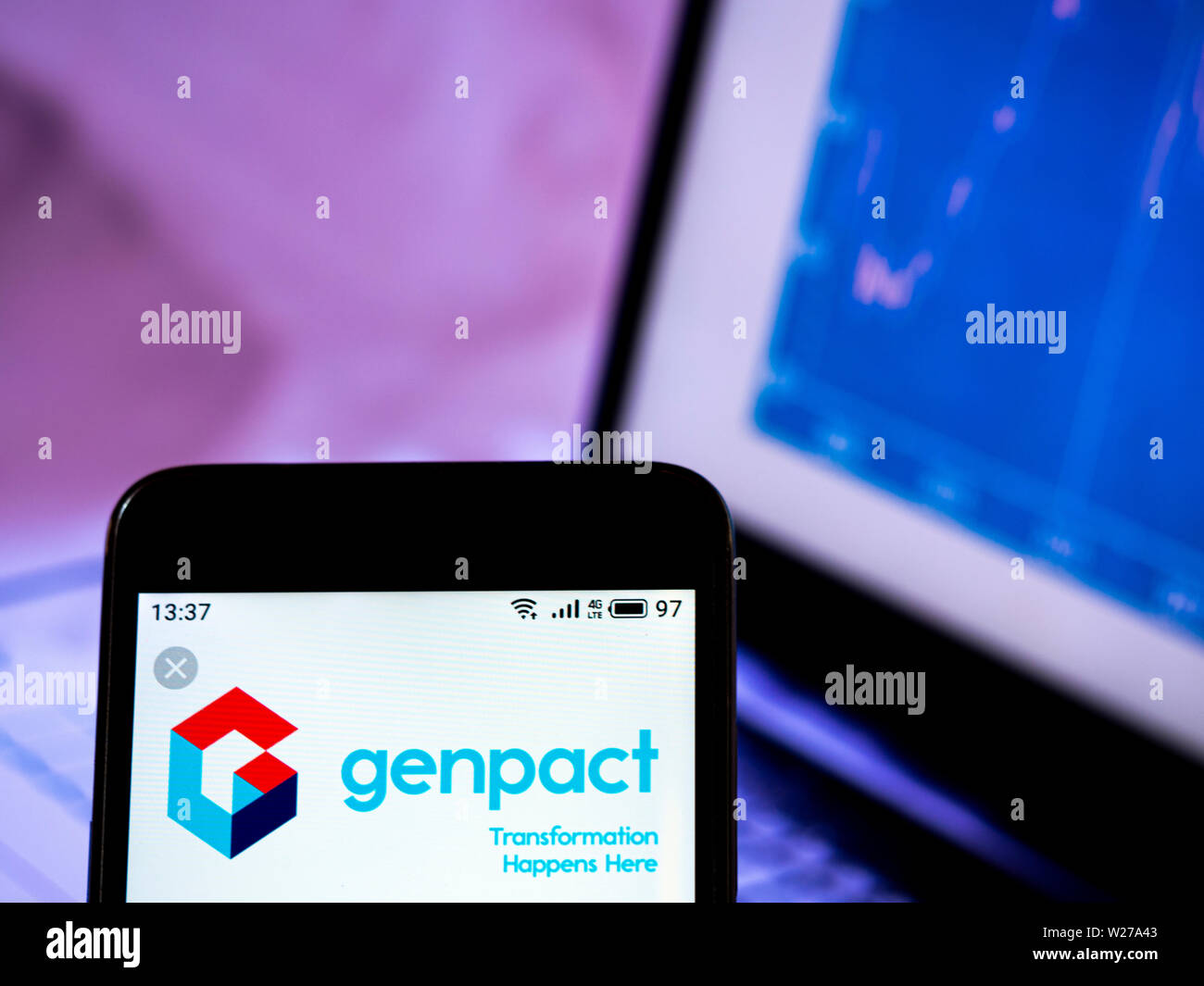 In this photo illustration the Genpact Ltd. logo is seen displayed on a ...