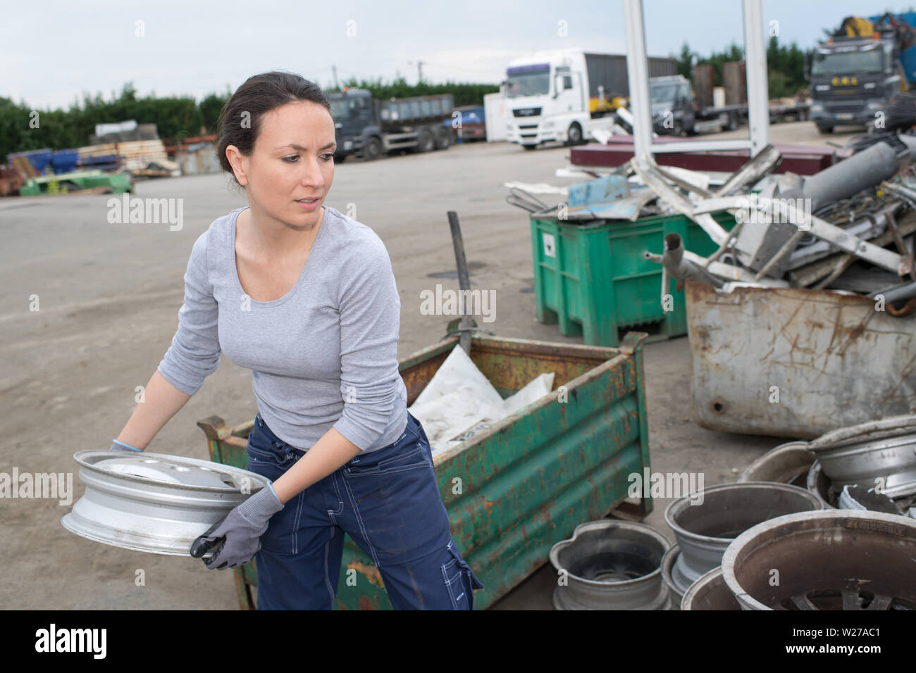 lady in scrap yard by car door Stock Photo - Alamy