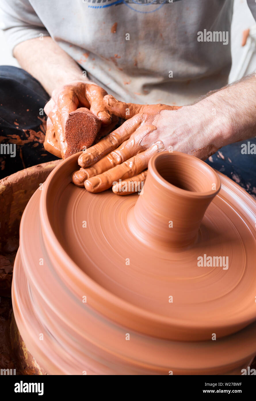 Professional potter making bowl in pottery workshop, studio Stock Photo ...