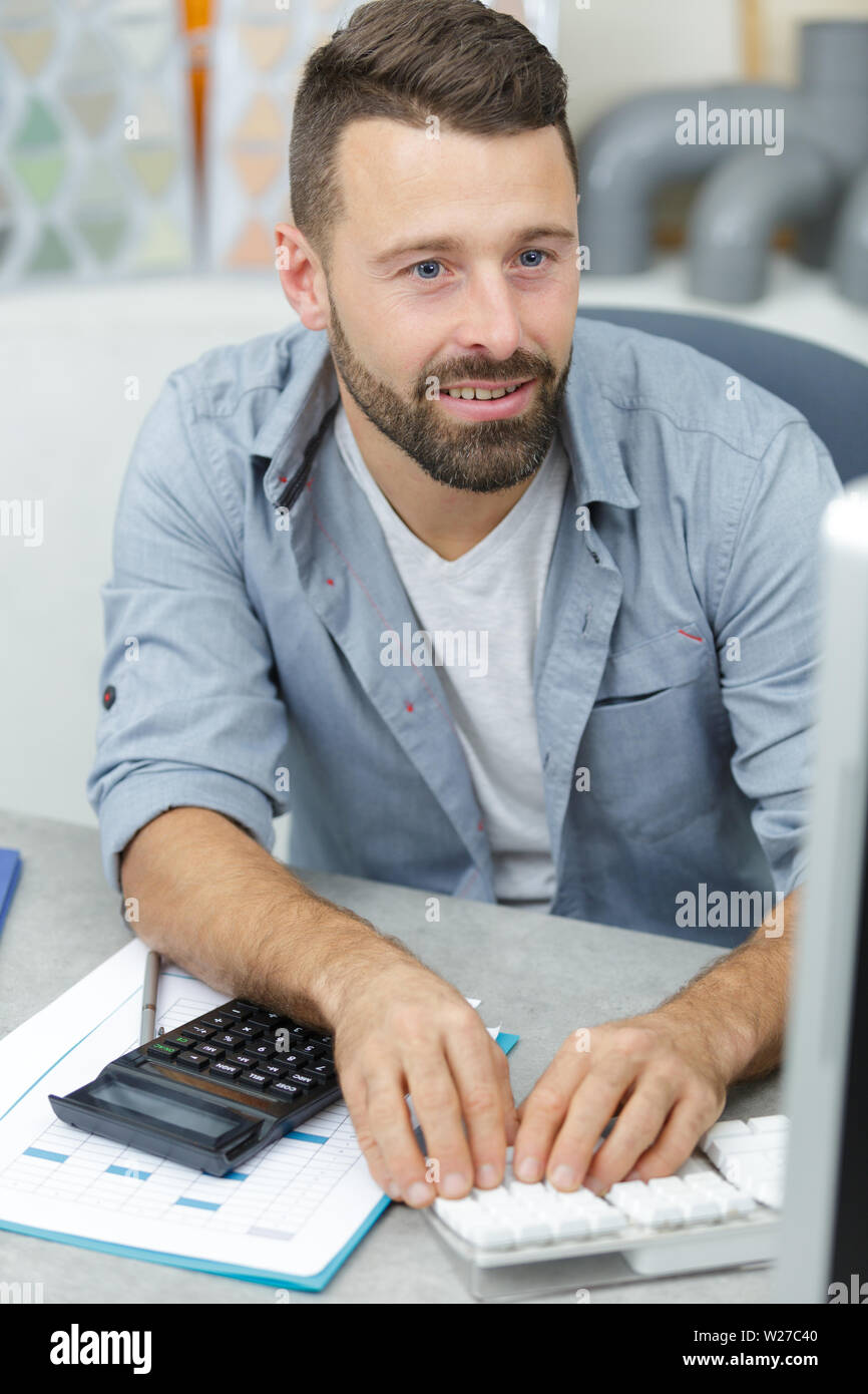 a man calculates the expenses Stock Photo - Alamy