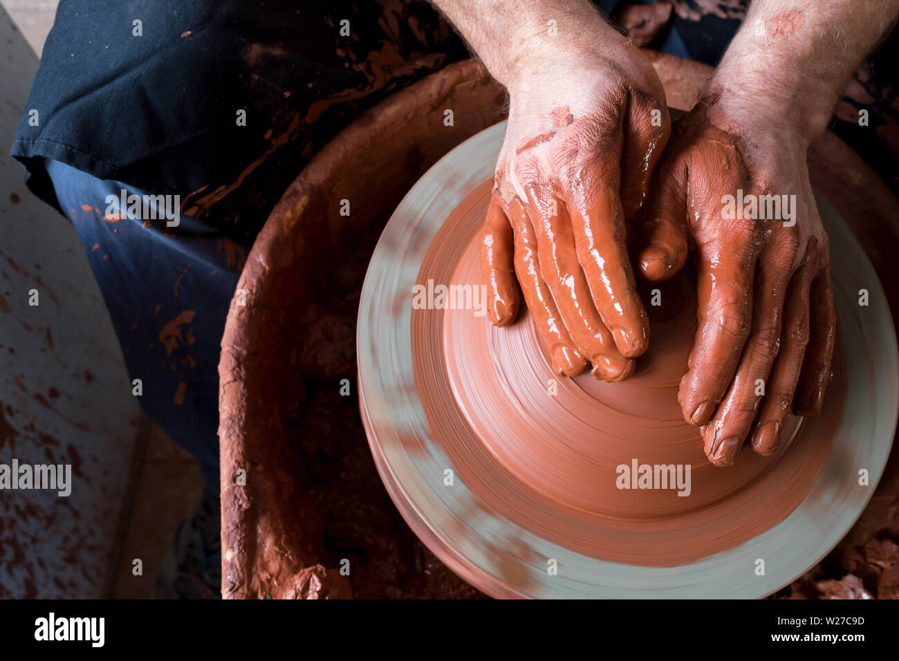 Professional potter making bowl in pottery workshop, studio Stock Photo ...