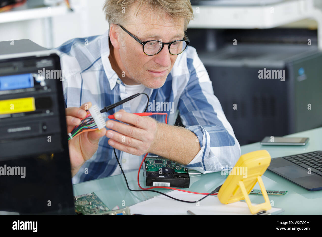 Person installing cables on hi-res stock photography and images - Alamy