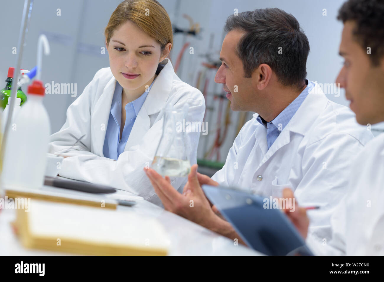 group of researchers during work on devices in laboratory Stock Photo ...