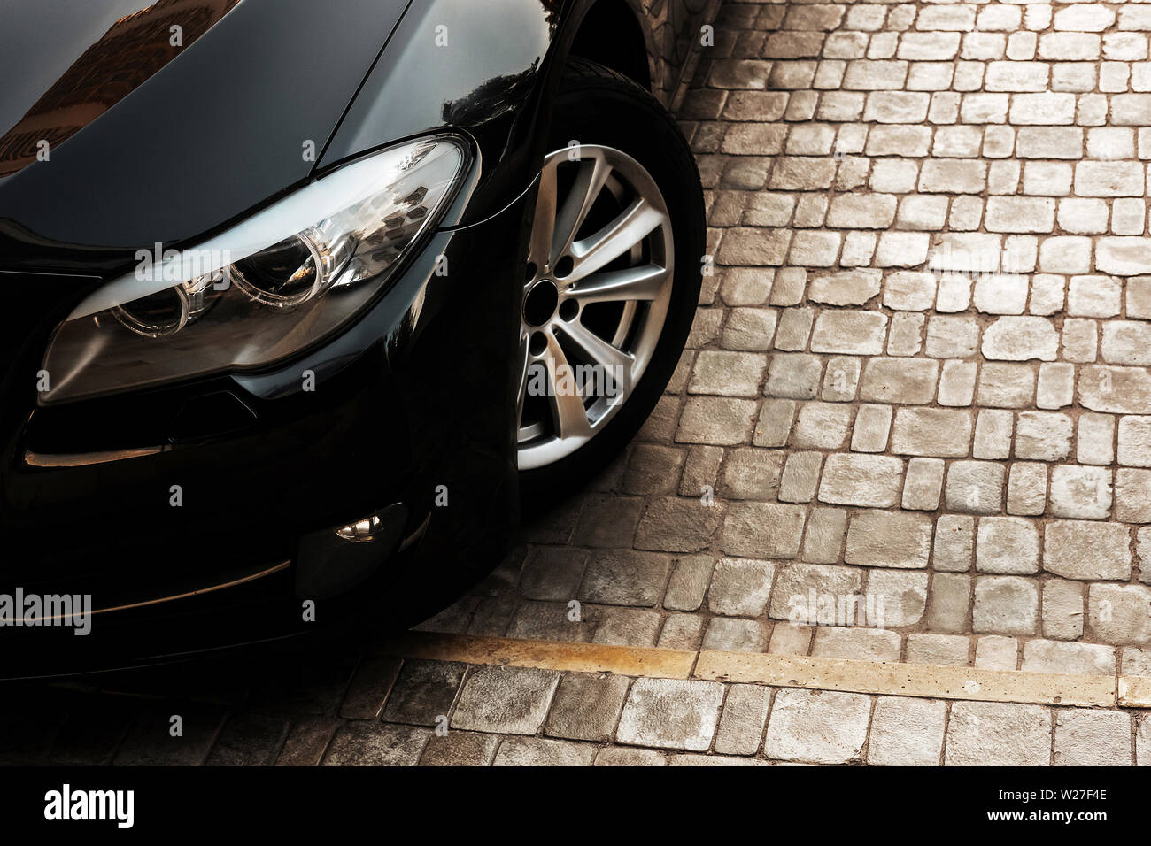 Front part of luxurious black car Stock Photo - Alamy