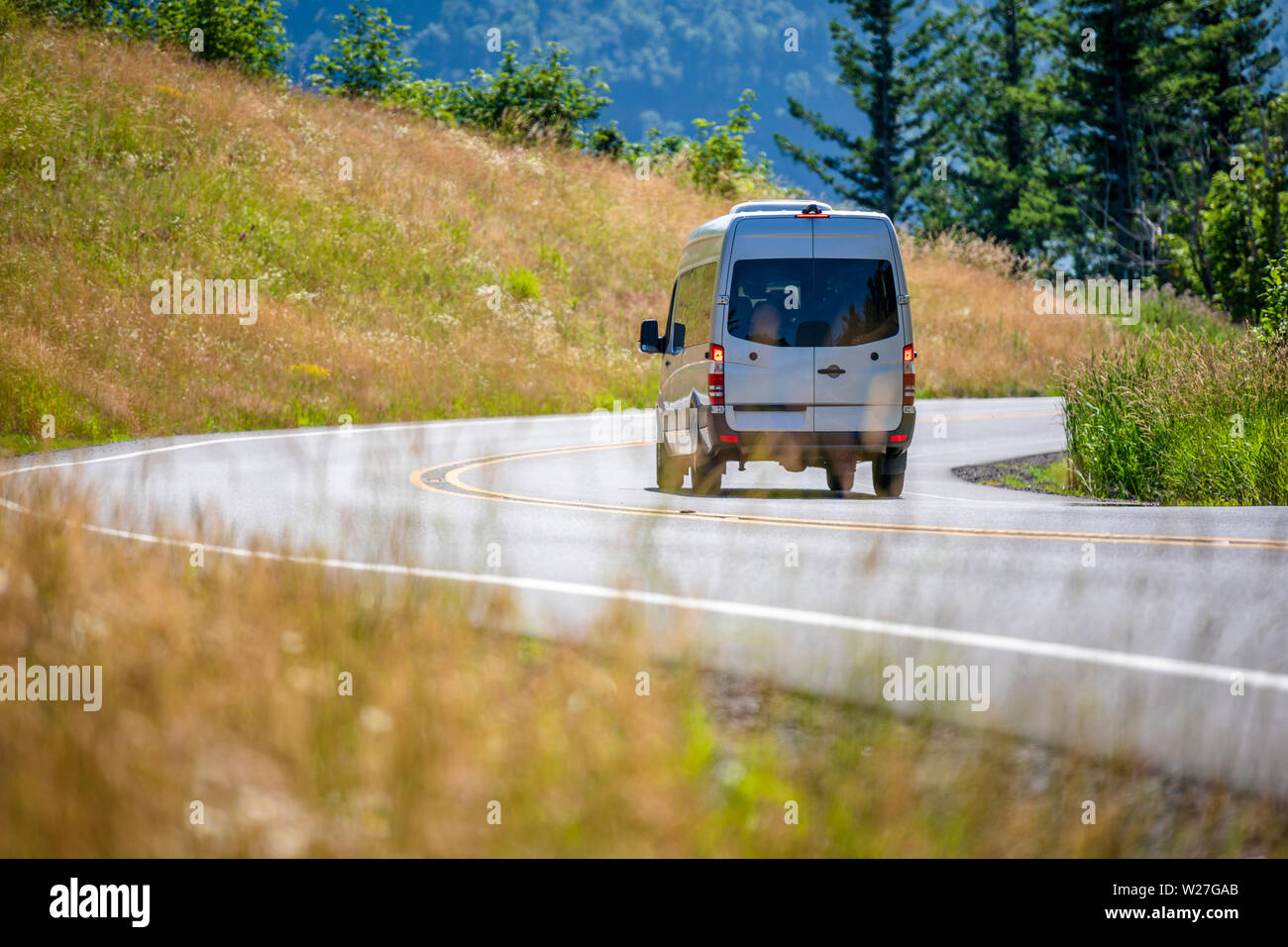 White delivery vans on the move hi-res stock photography and images - Alamy