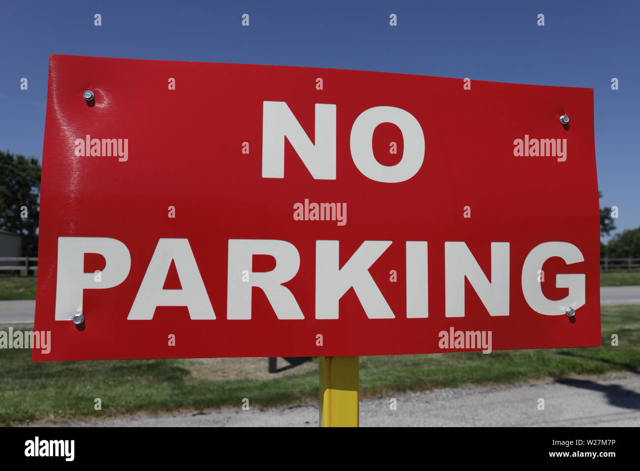 No Parking sign in red and white letters I Stock Photo - Alamy
