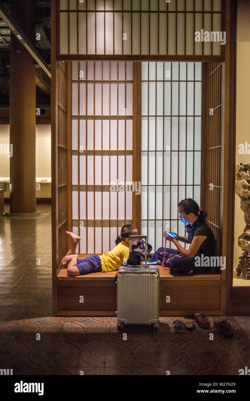 Tourists rest in a museum in the Forbidden City in Beijing, China Stock ...