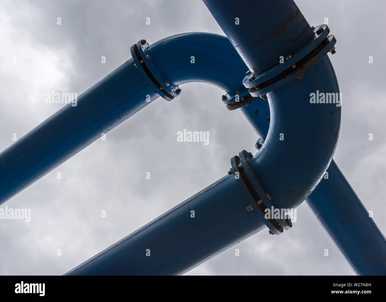 Two water pipes overlap under the sky Stock Photo - Alamy
