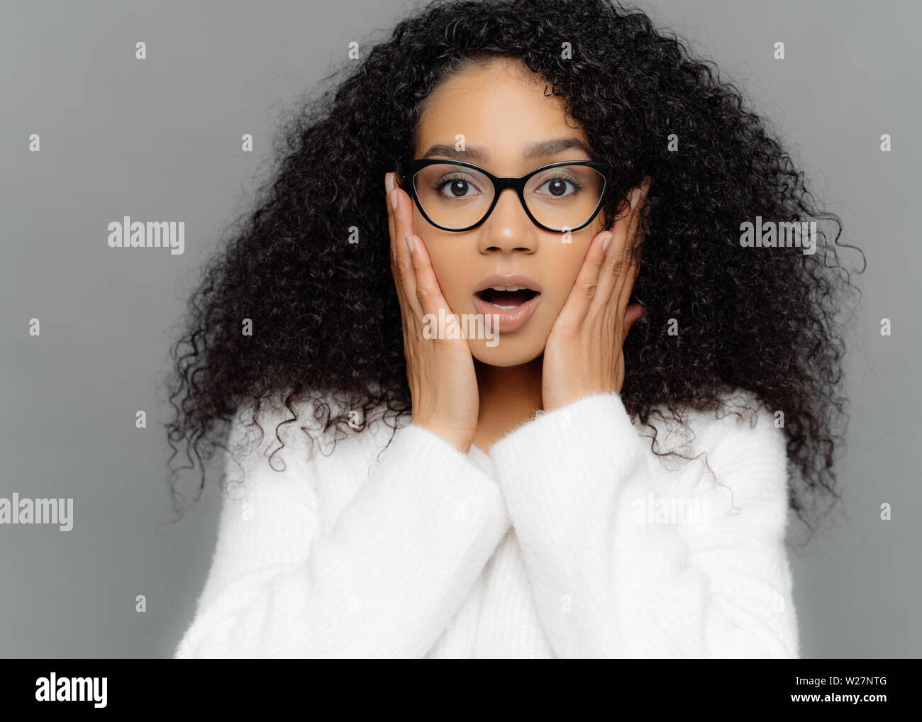 Close Up Portrait Of Shocked Concerned Young Woman With Dark Skin And