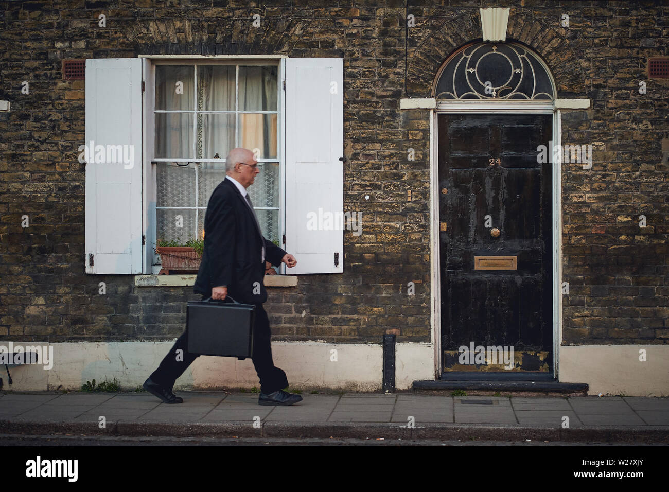 Man walking london street hi-res stock photography and images - Alamy