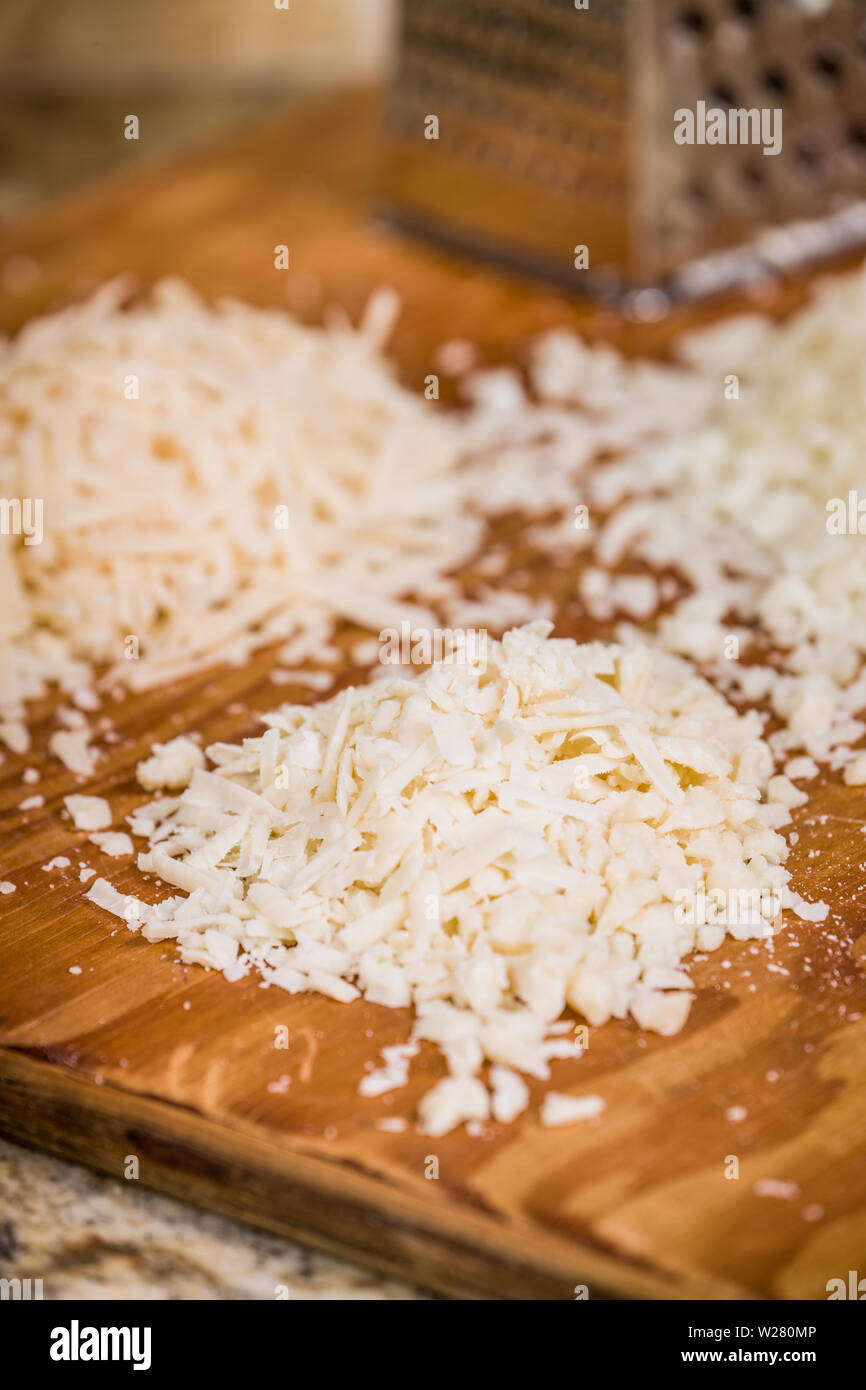 Using a variety (mozzarella, parmesan, romano) of grated cheeses on a ...