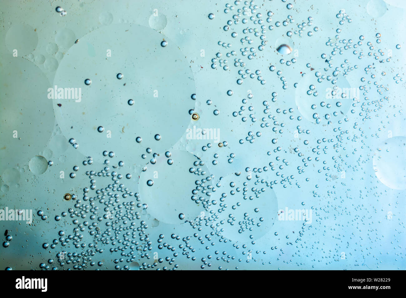 Oil bubbles inside water base form patterns Stock Photo - Alamy