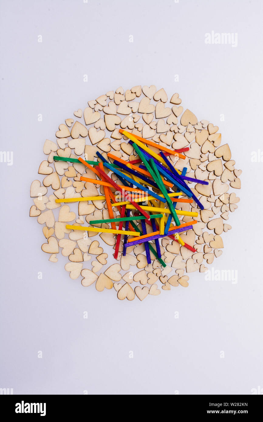 Beautiful coloured wooden sticks for creativity on black background ...