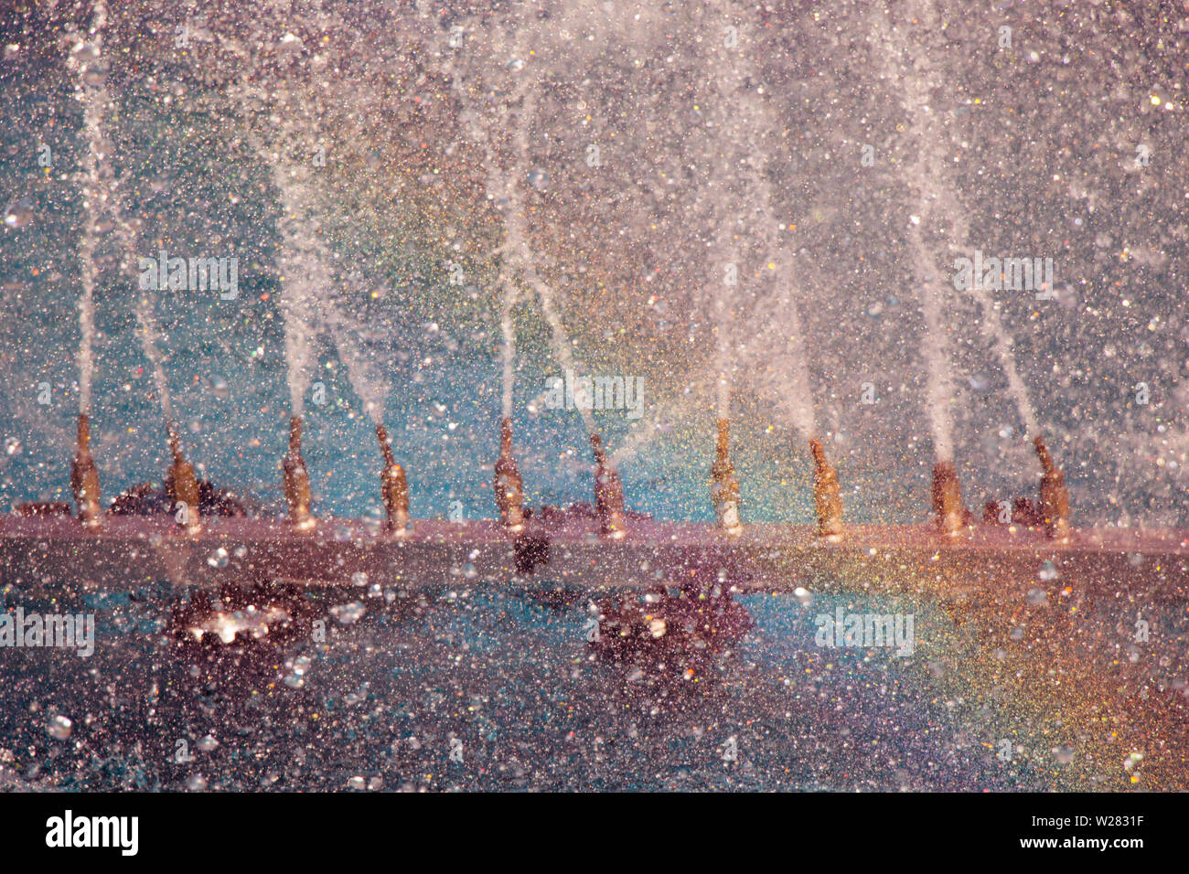 A water fountain sprinkling water in the view Stock Photo - Alamy