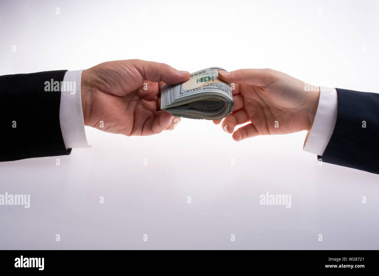 Businessman giving and receiving US dollar banknote money Stock Photo ...