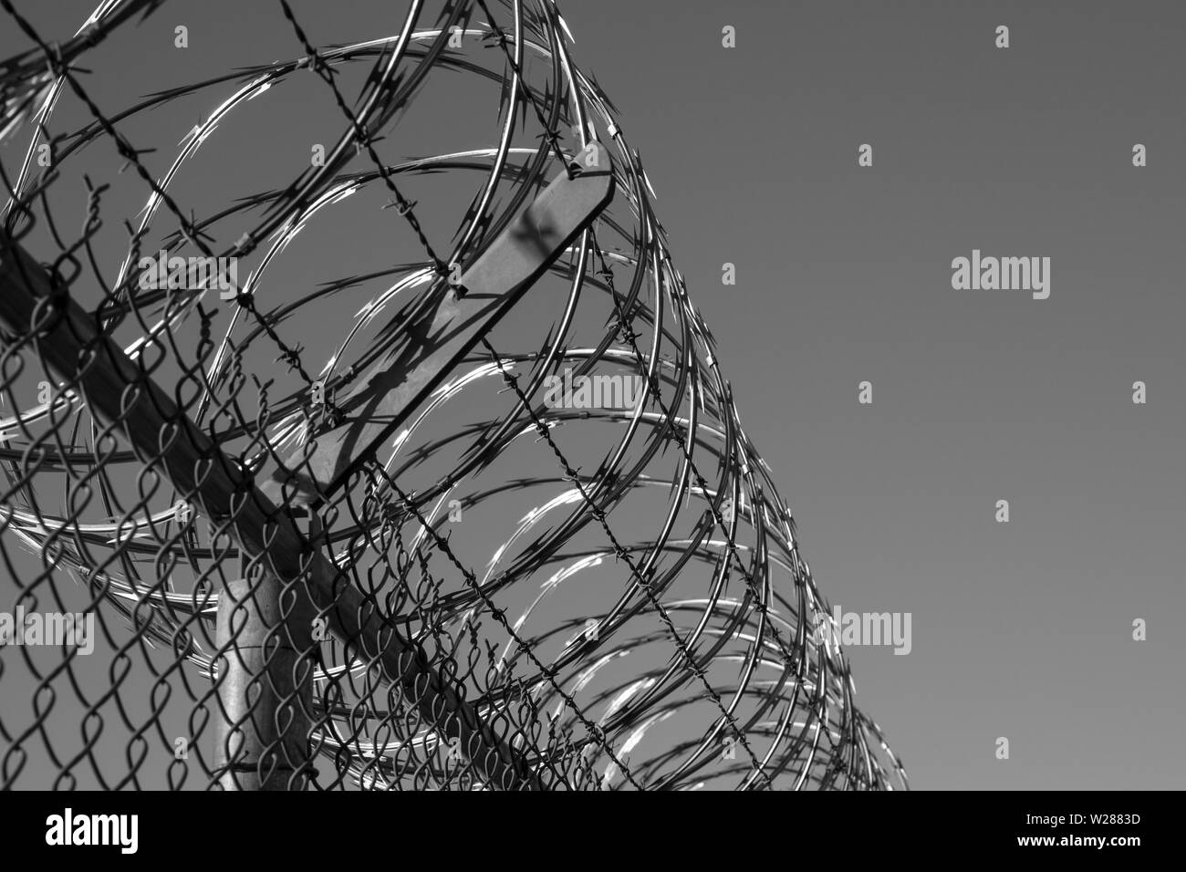 Razor wire across fence surrounding an Arizona Border Patrol station ...