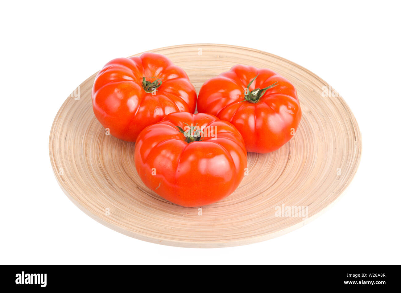 Three red ripe tomato beef. Studio Photo Stock Photo - Alamy