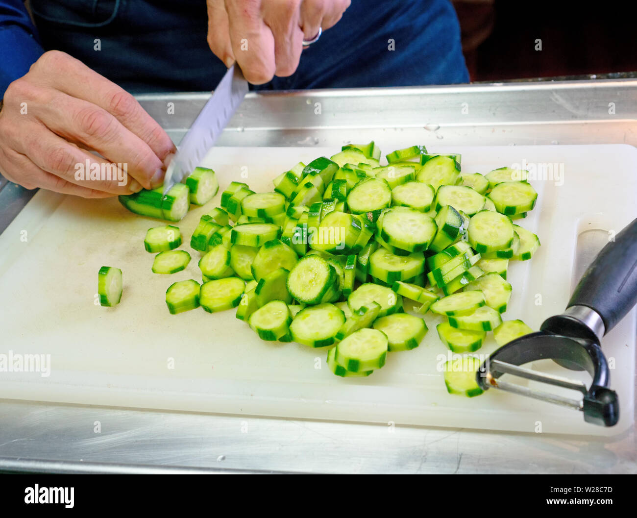 Cutting cucumbers hi-res stock photography and images - Alamy