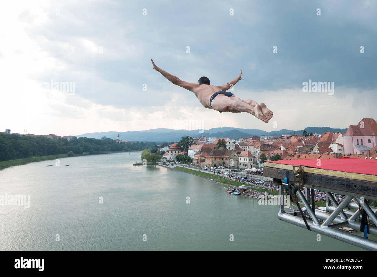 Marko Pavlovic of Serbia dives from the Old Bridge during 19th annual ...